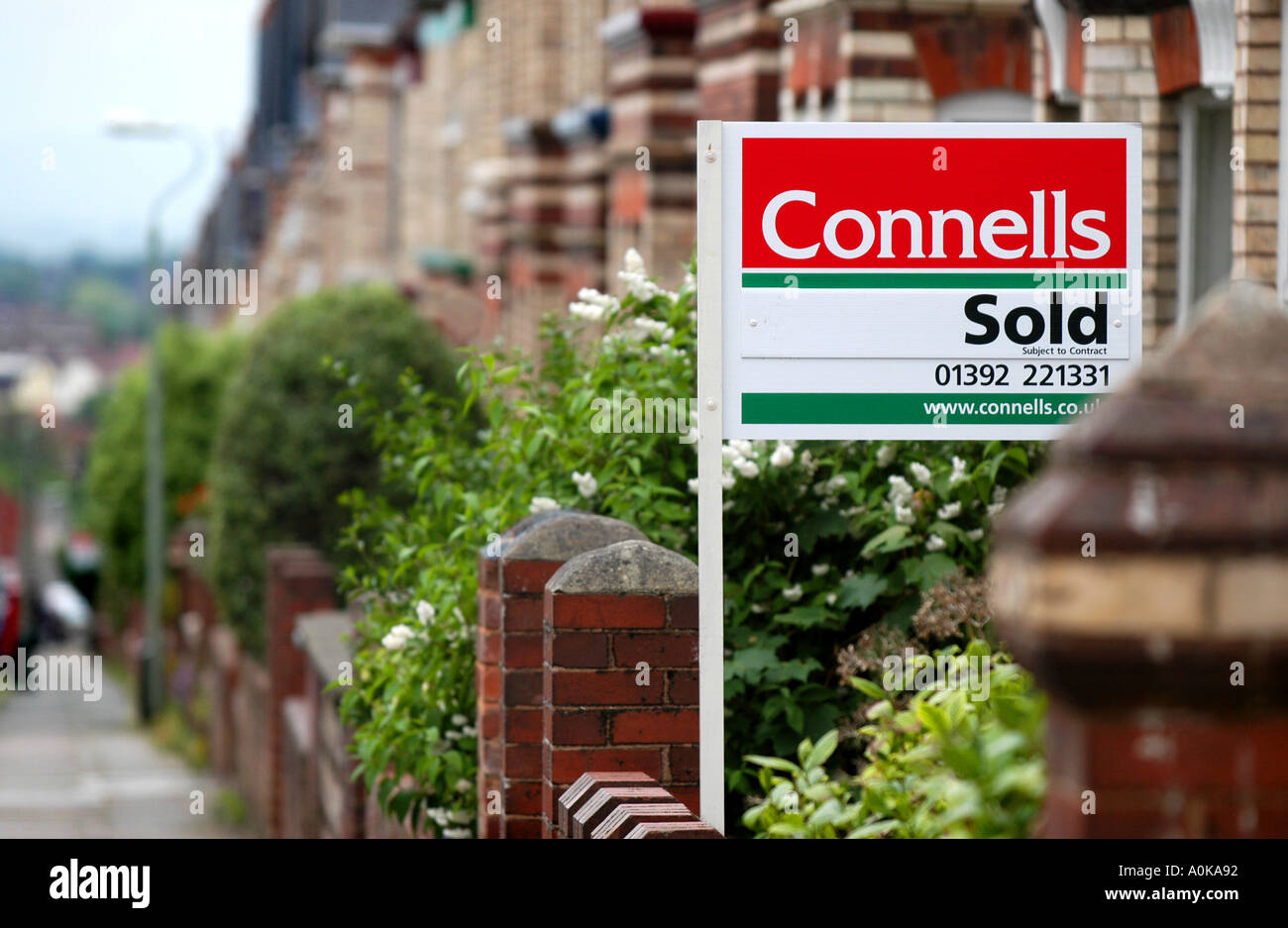 an estate agents sold board sign on a street in Exeter, Devon Stock ...