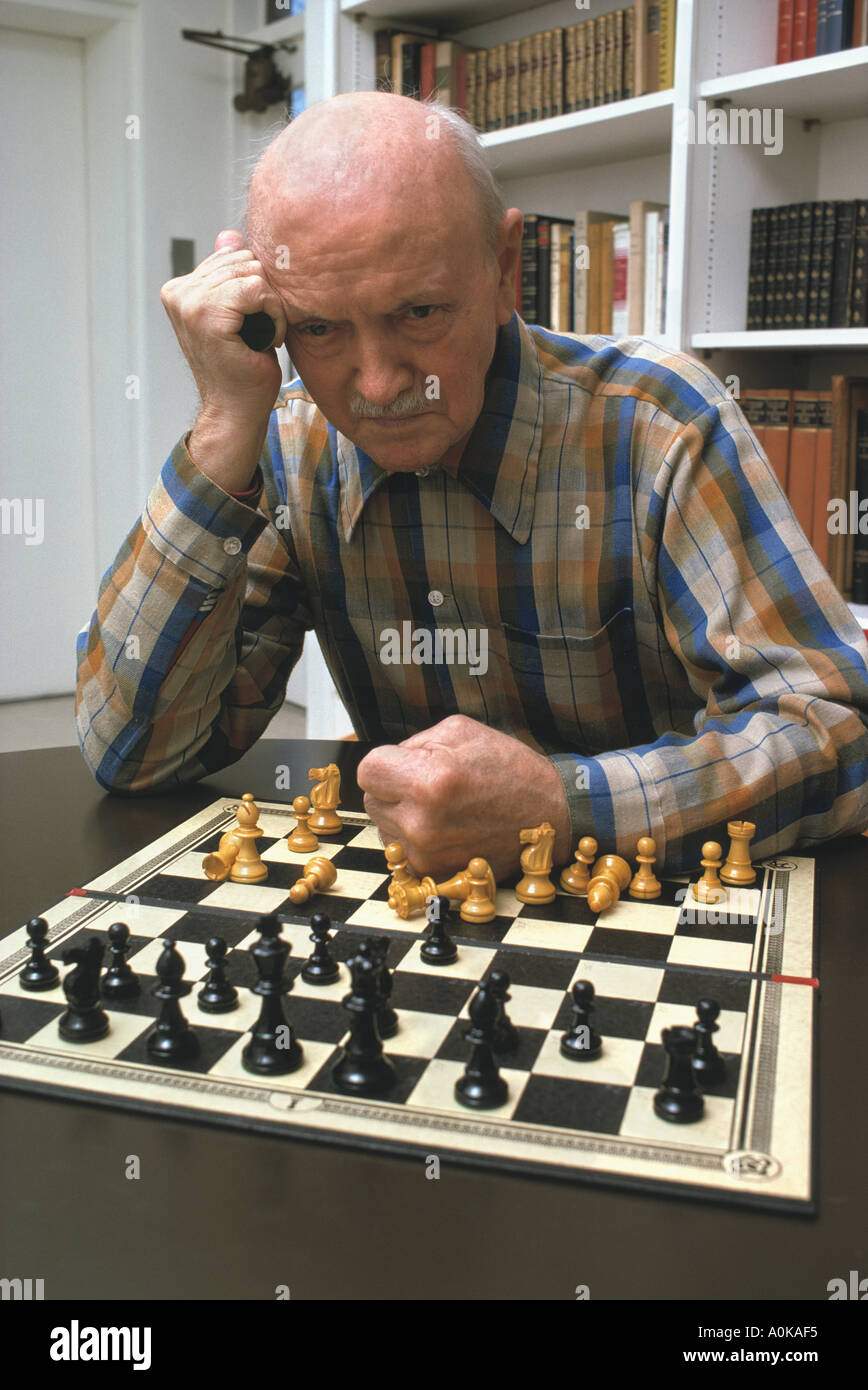 Angry Elderly man in nursing home playing chess with look of ...
