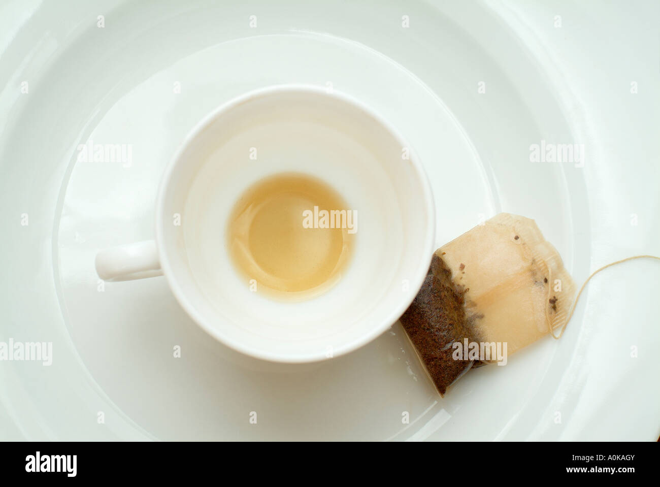 still life of empty tea cup and tea bag Stock Photo - Alamy