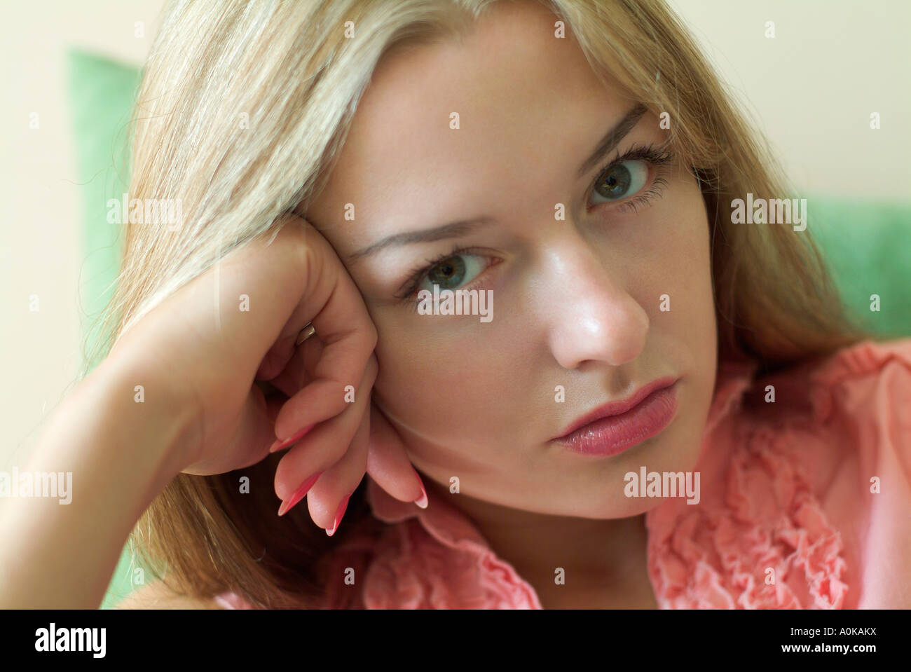 portrait of grumpy looking young woman Stock Photo - Alamy