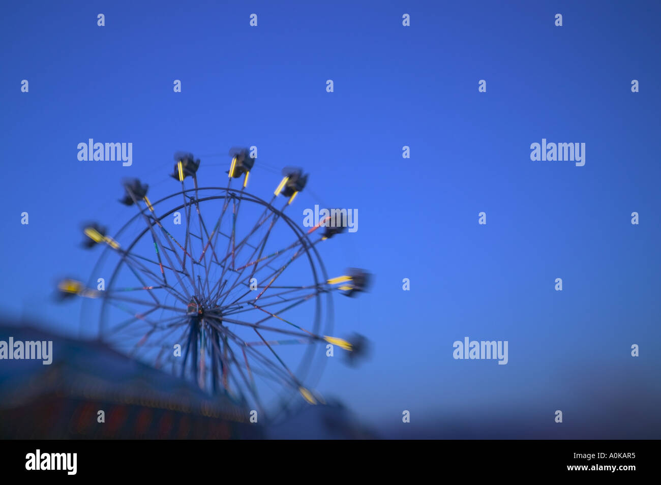 Ferris wheel lit up in evening on the midway, Western Idaho Fair, Boise ...