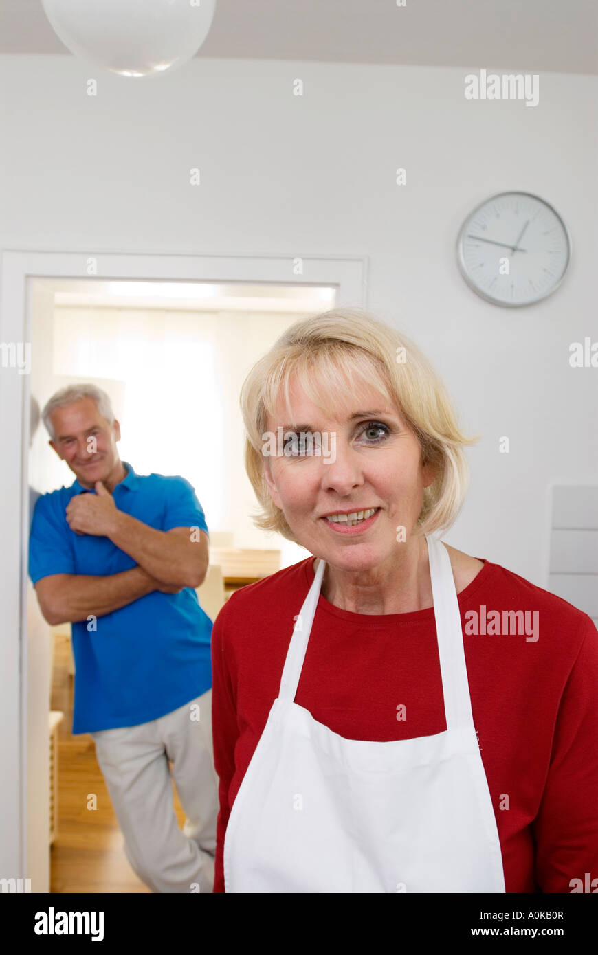 portrait of woman while man is giving a mischievous look Stock Photo ...