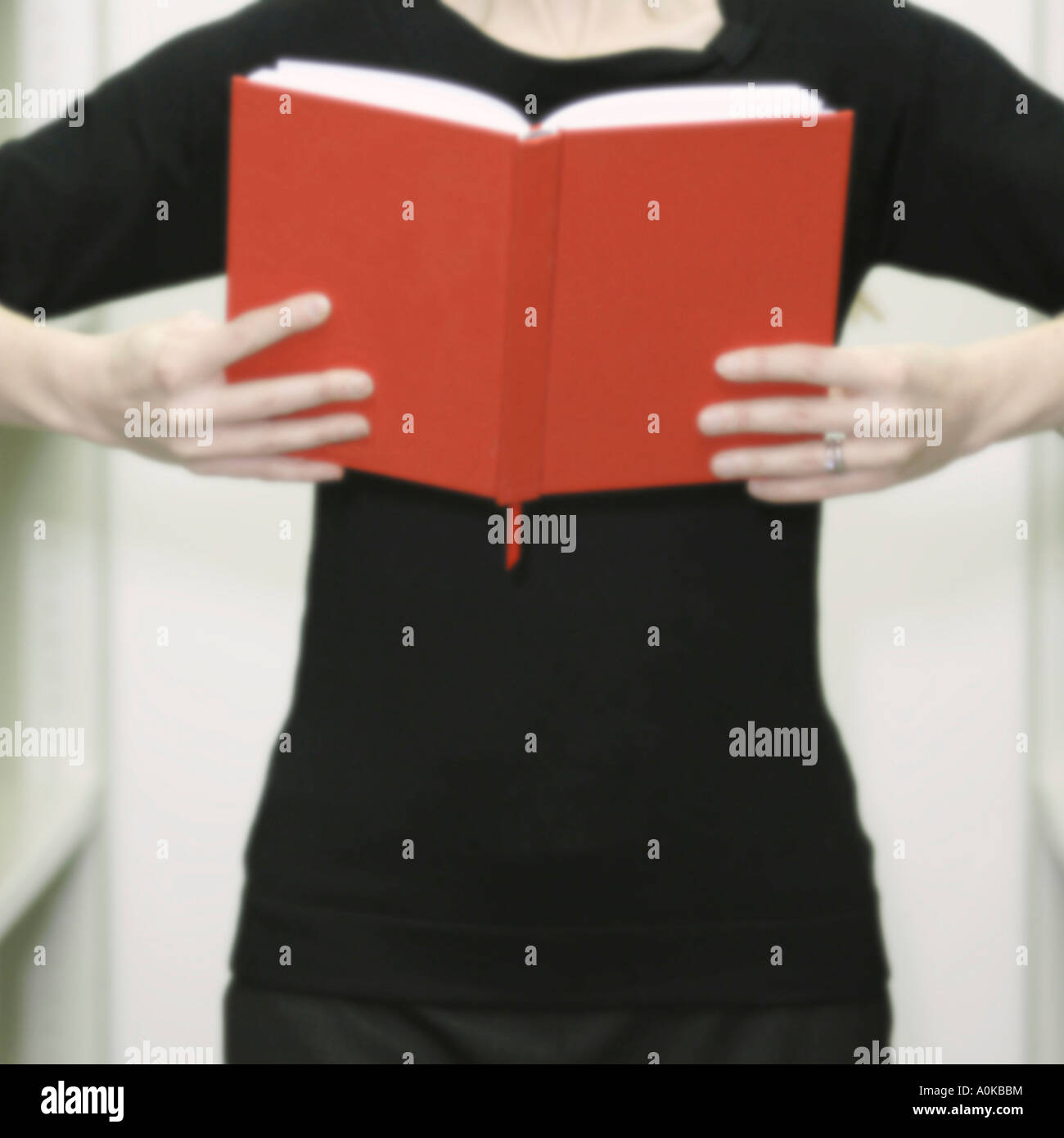 woman reading red book Stock Photo - Alamy