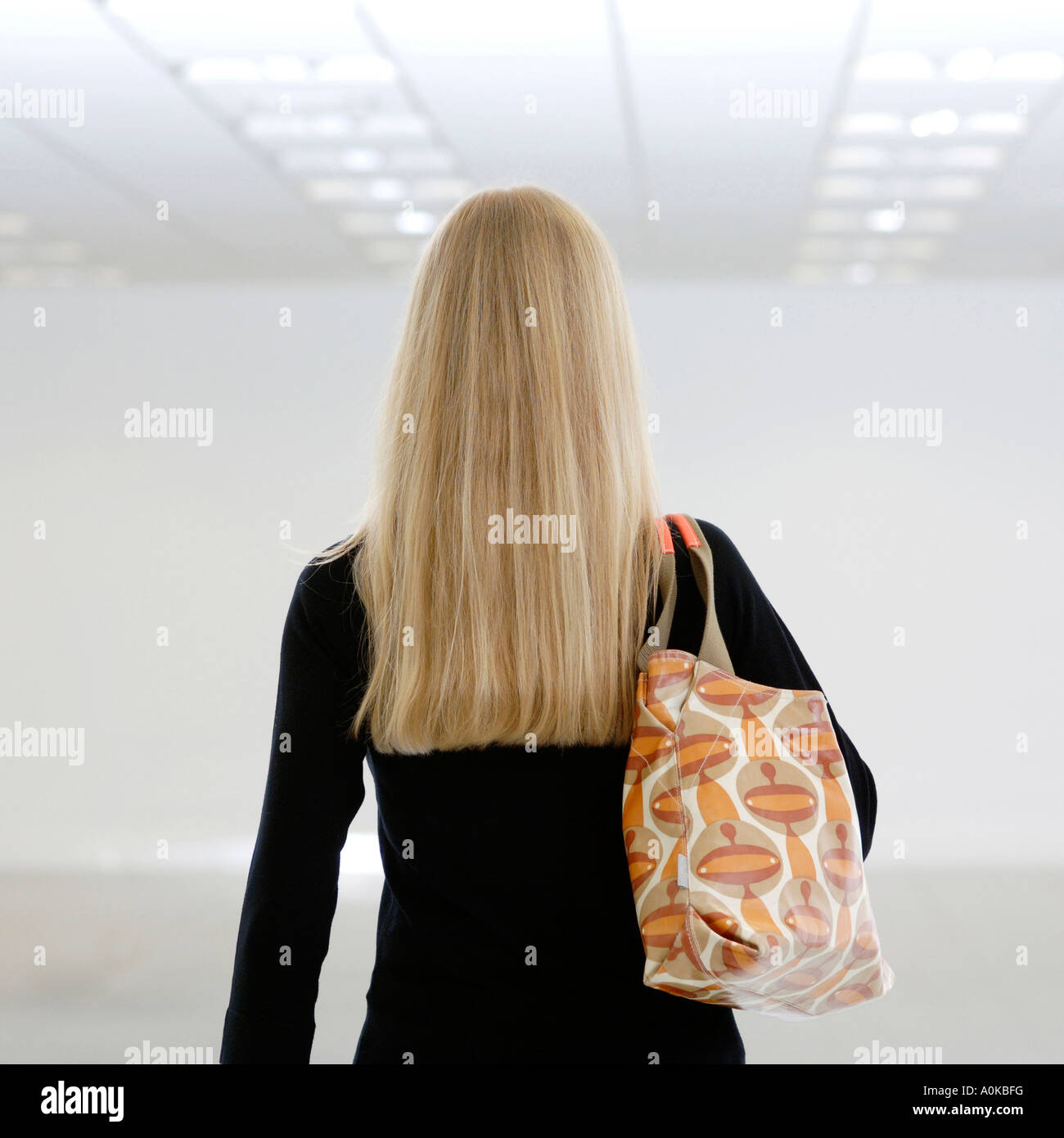 rear view of blonde with handbag over shoulder Stock Photo - Alamy
