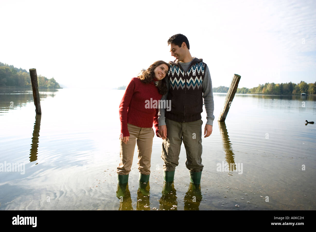 contented young couple standing in lake Stock Photo - Alamy