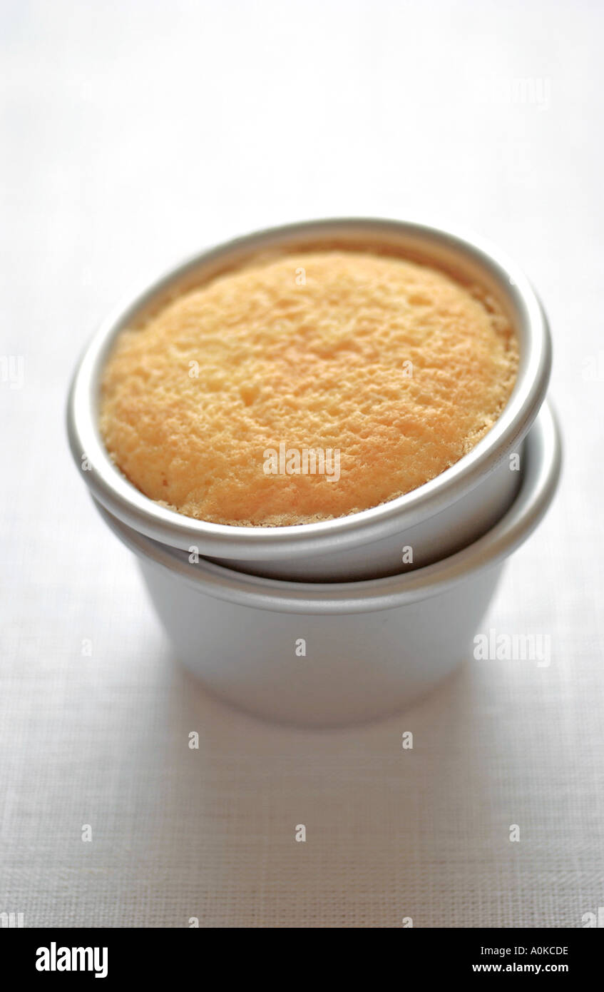 Pudding Tins on white linen Stock Photo - Alamy