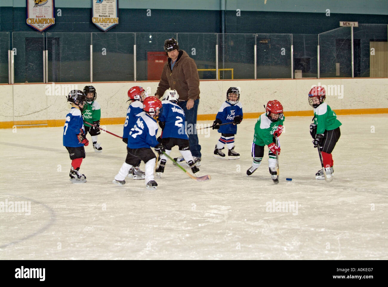 5 year old boys and girls are learning the fundamentals of playing ice ...