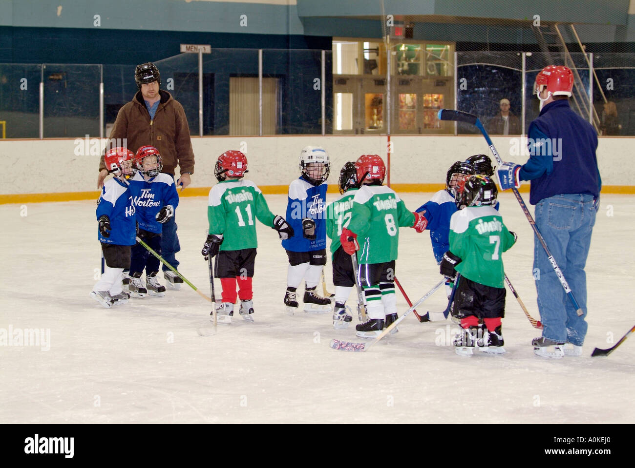 5 year old boys and girls are learning the fundamentals of playing ice ...