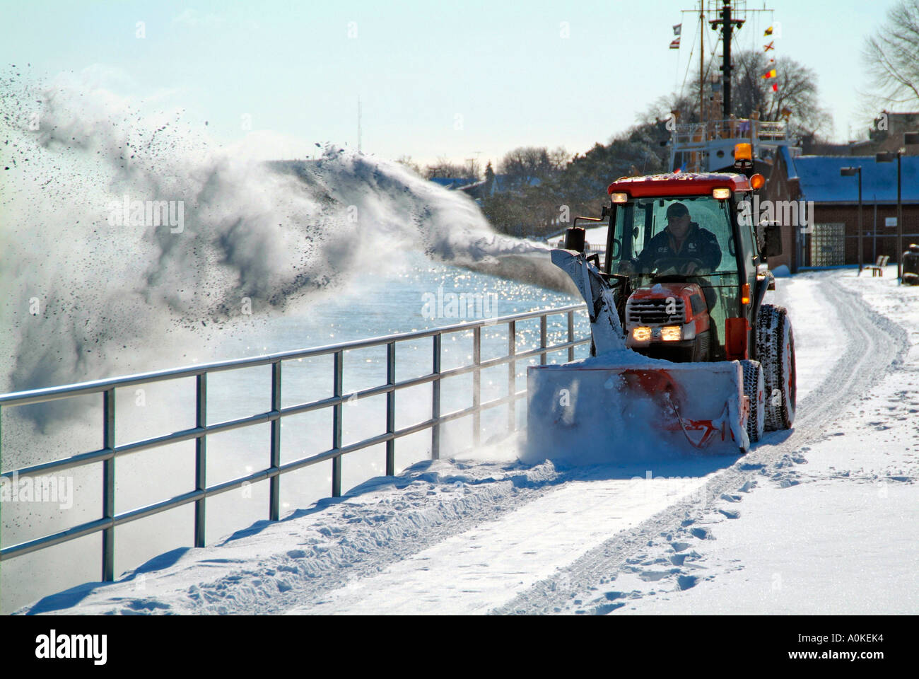 Clearing Snow From Property With heavy duty Snow Blower equipment Stock ...