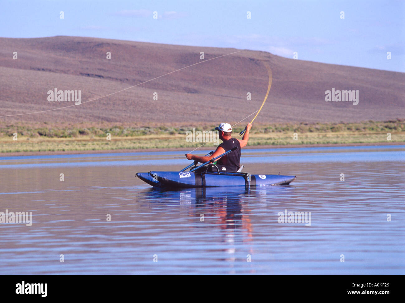 man casting fly in lake from pontoon raft cataraft Mann Lake Northern ...