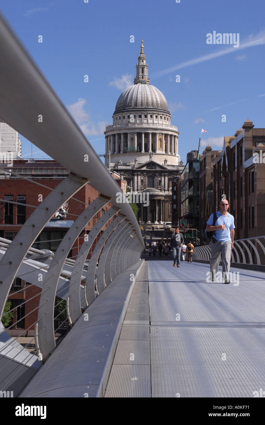 A pedestrian walking over the new Millennium Bridge that crosses the ...
