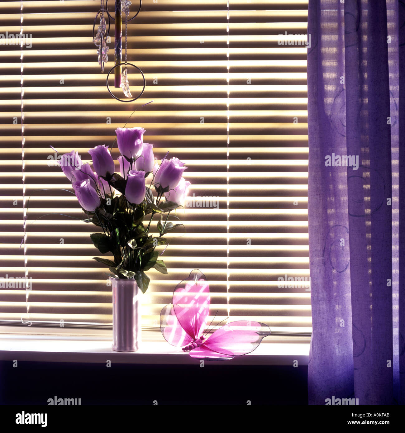 Flowers on window ledge Stock Photo - Alamy