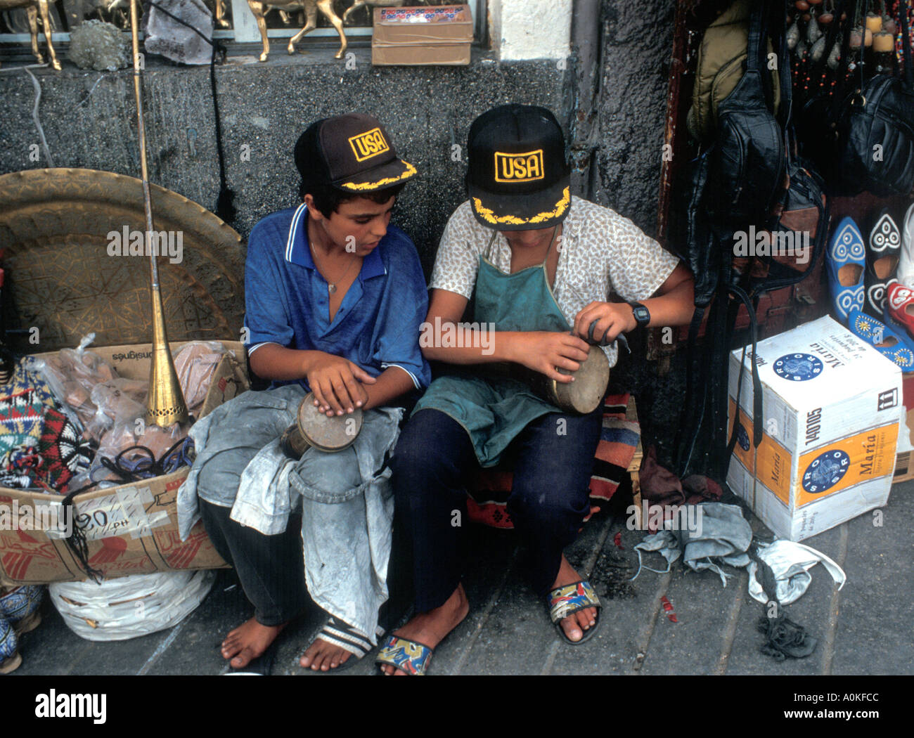 Children at work in the back streets of Tangier Moroco Stock Photo - Alamy