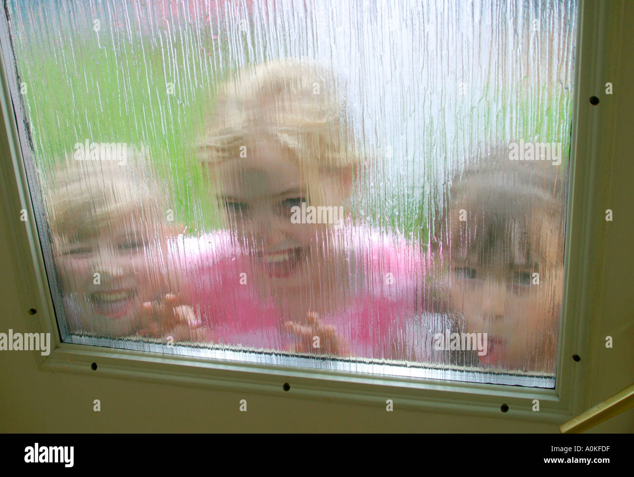 YOUNG GIRLS AT WINDOW Stock Photo - Alamy