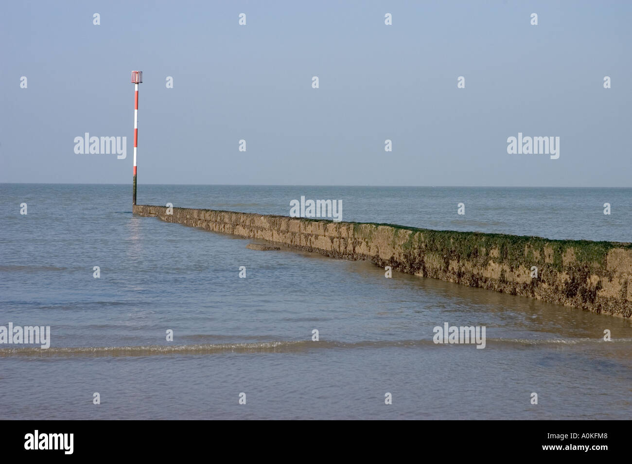Concrete breakwater leading out to sea Minnis Bay Birchington Kent ...