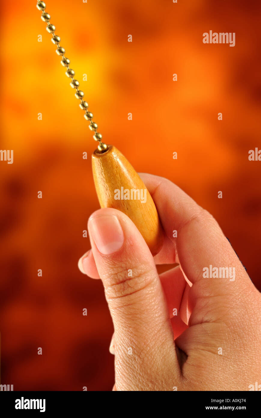 Fingers pulling chain on lamp Stock Photo - Alamy