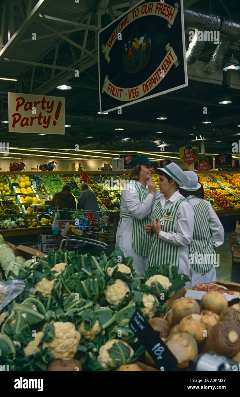 Staff in the fruit and vegetable section of an ASDA supermarket in ...