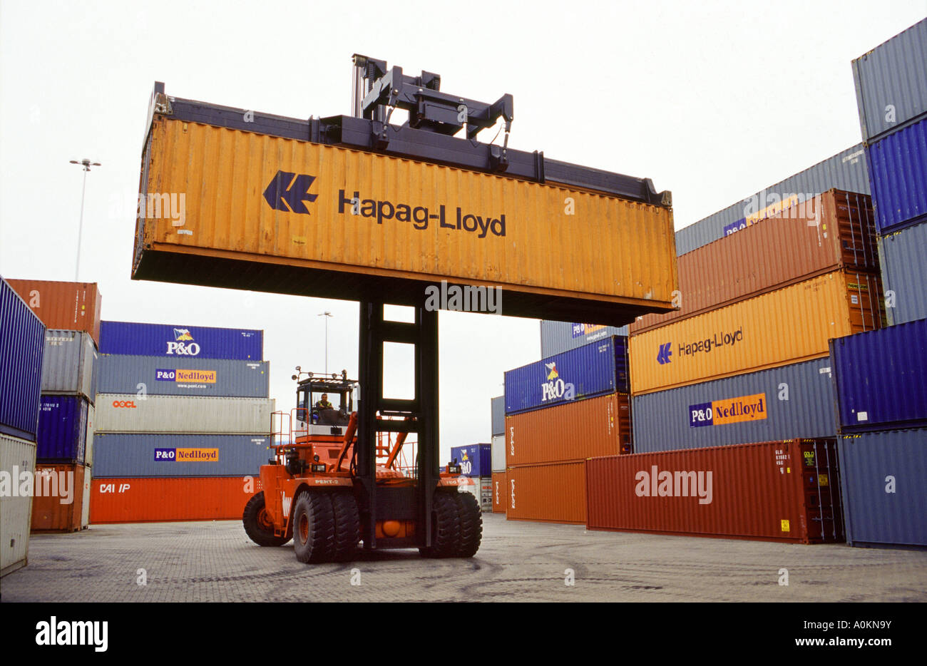 High lift fork truck with spreader Stock Photo - Alamy