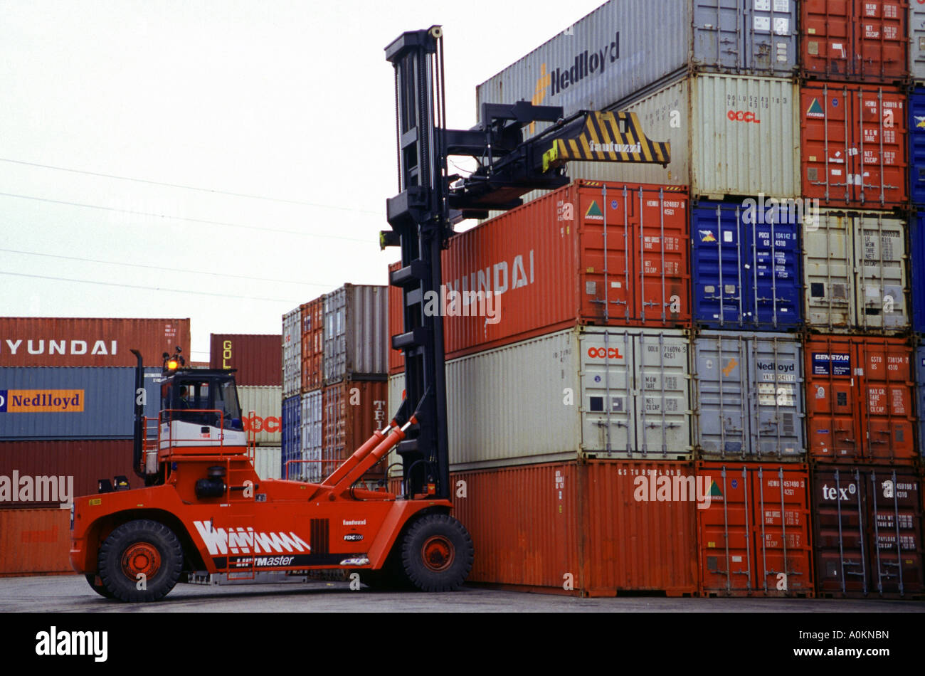 High lift fork truck with spreader Stock Photo - Alamy