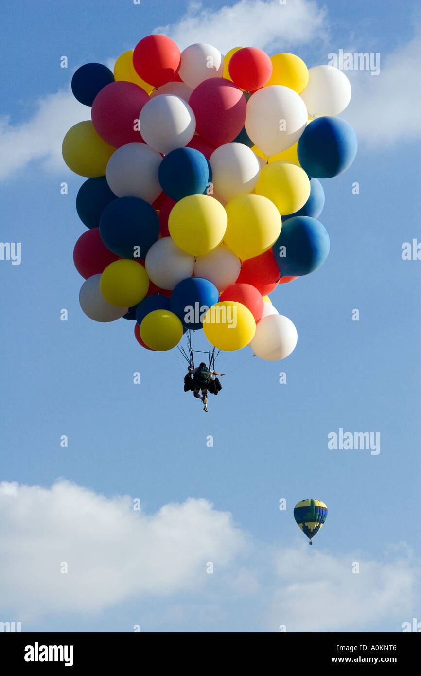 Cluster balloonist in flight Stock Photo - Alamy