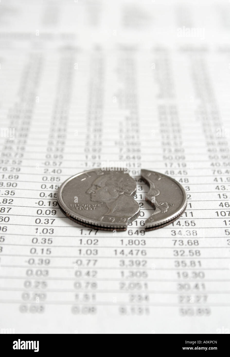 Broken coin against number background Stock Photo - Alamy