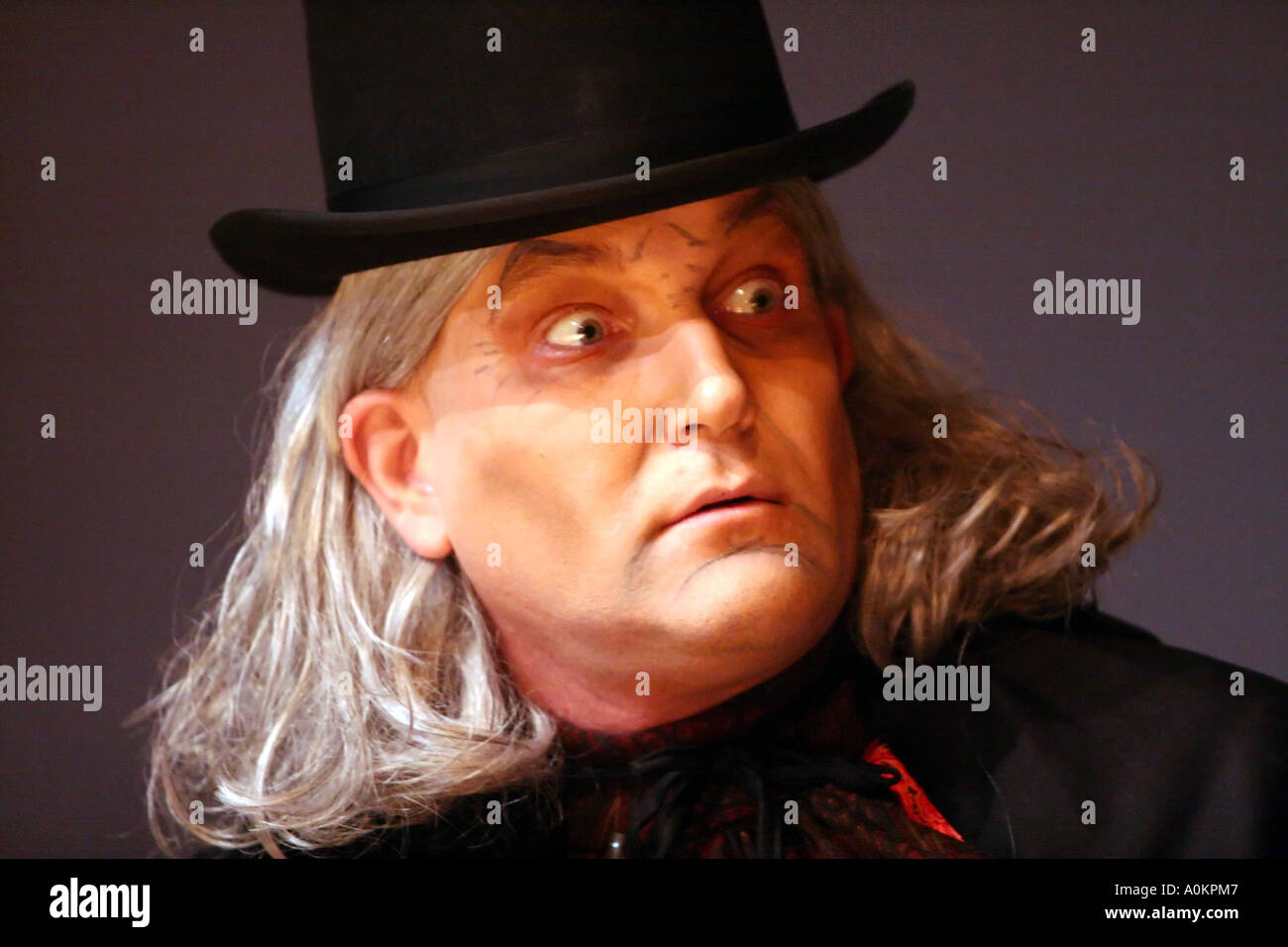 Actor dressed as an evil old man Stock Photo - Alamy