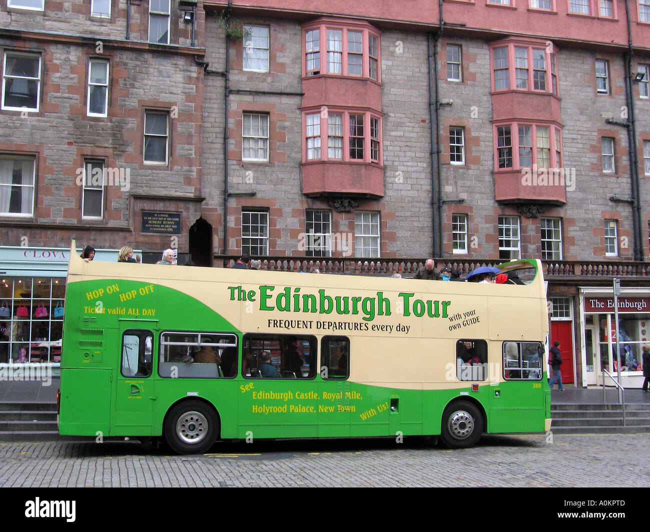 Green and cream Edinburgh open top double decker tour bus on the royal ...