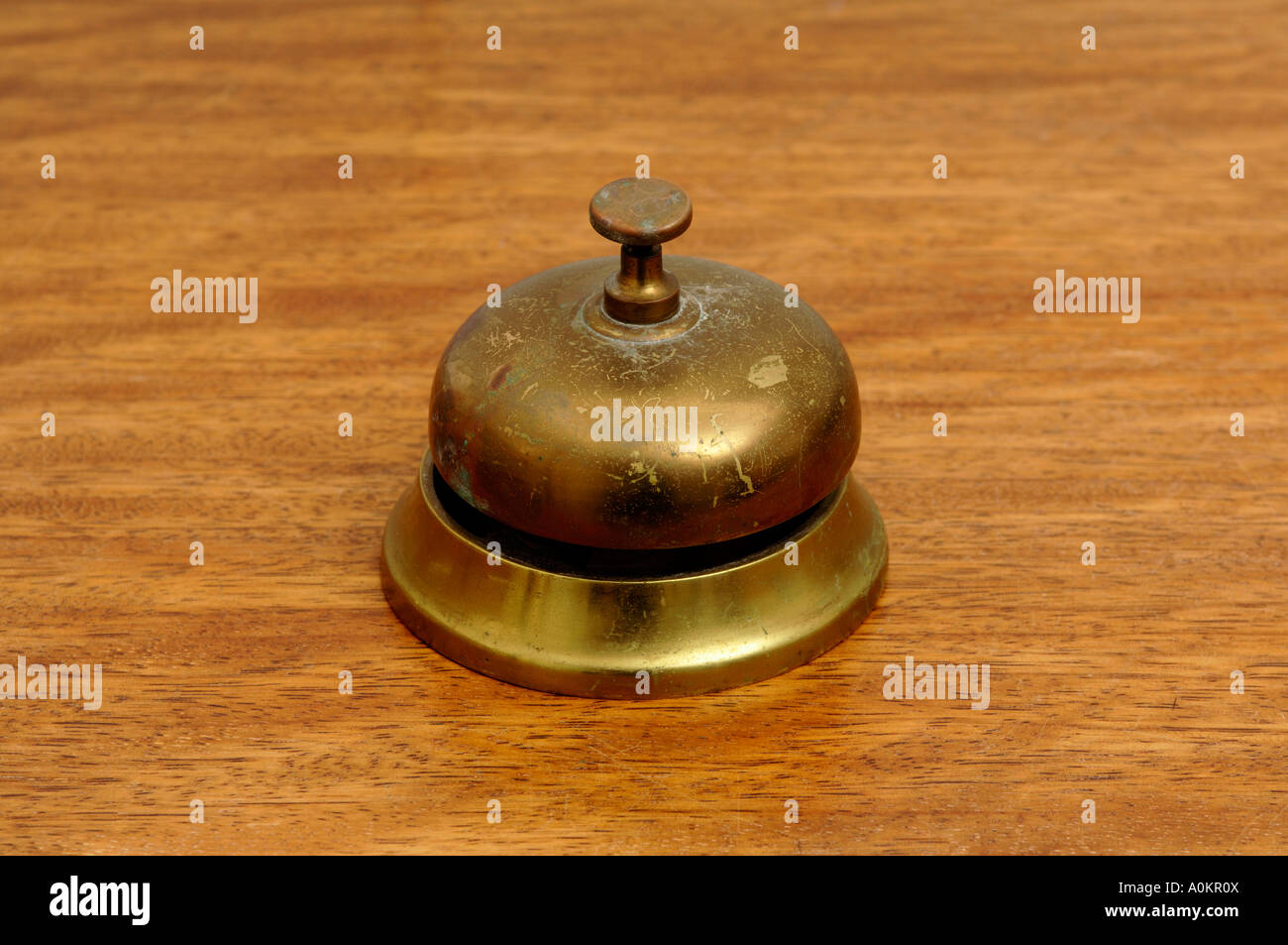 Old tarnished worn reception bell Stock Photo - Alamy