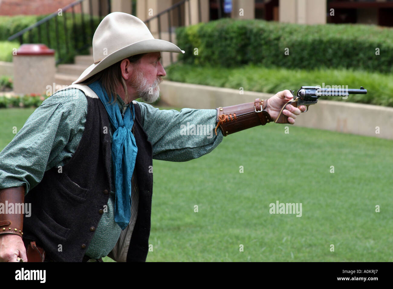 Cowboy actor holding a six gun Stock Photo - Alamy