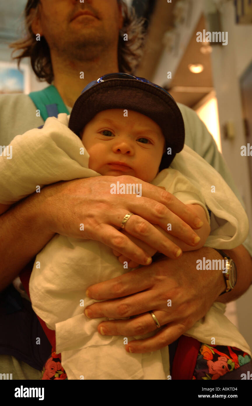 small baby wrapped in fathers hands dsca 0285 Stock Photo - Alamy
