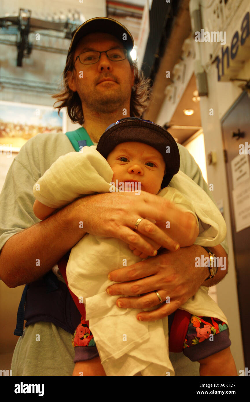 small baby wrapped in fathers hands dsca 0286 Stock Photo - Alamy