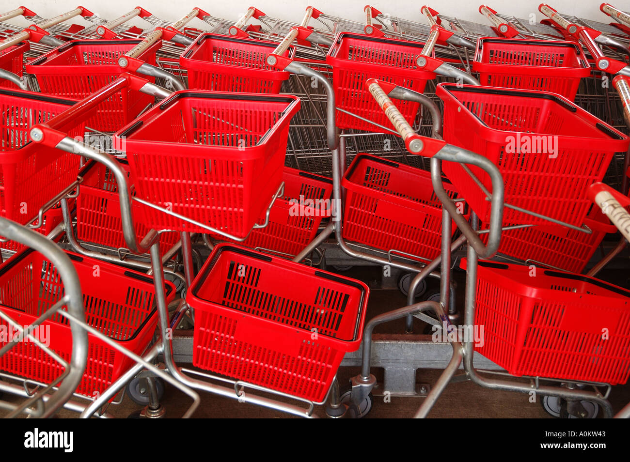 Modern small shopping trolleys and baskets in trendy shopping precinct ...