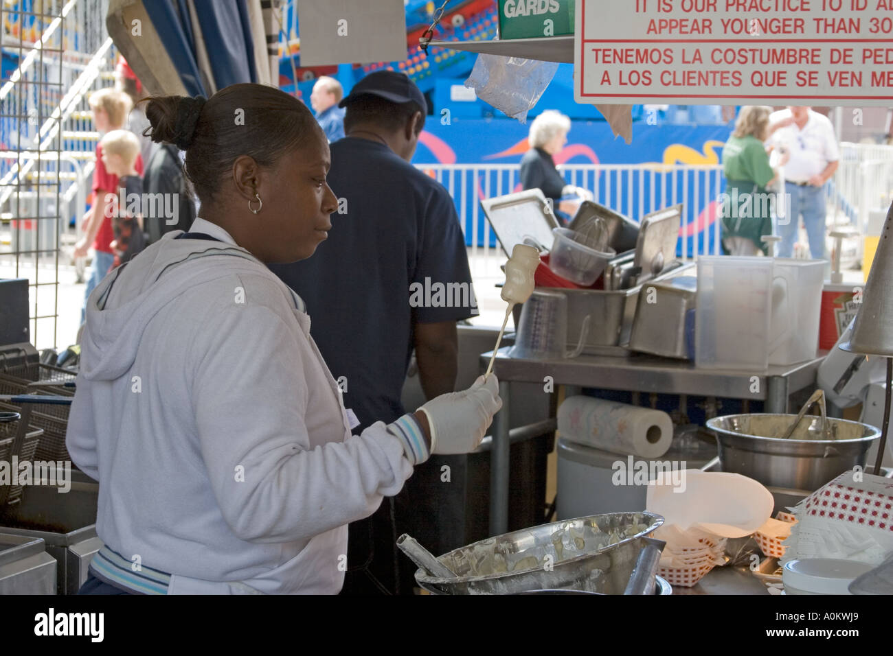 Festival worker preparing fried marshmallows Stock Photo - Alamy