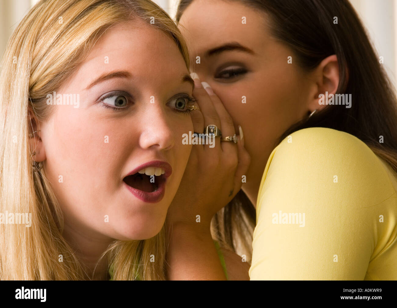 Caucasian Teen Girl (15-17) Whispers Shocking Secret in the Ear of Her ...