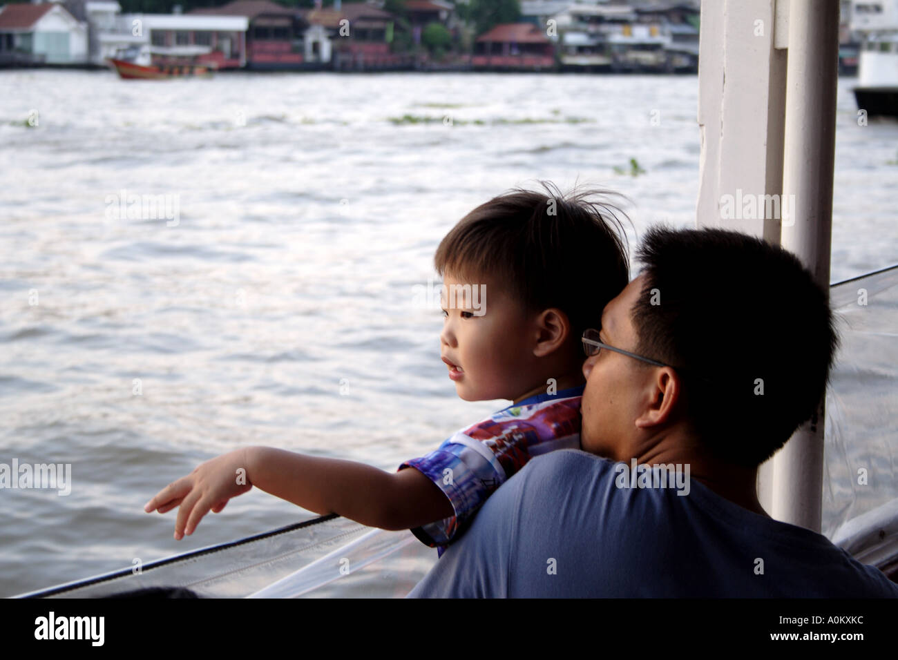 Thai father and son on the Chao Phraya River, Bangkok Thailand Stock ...