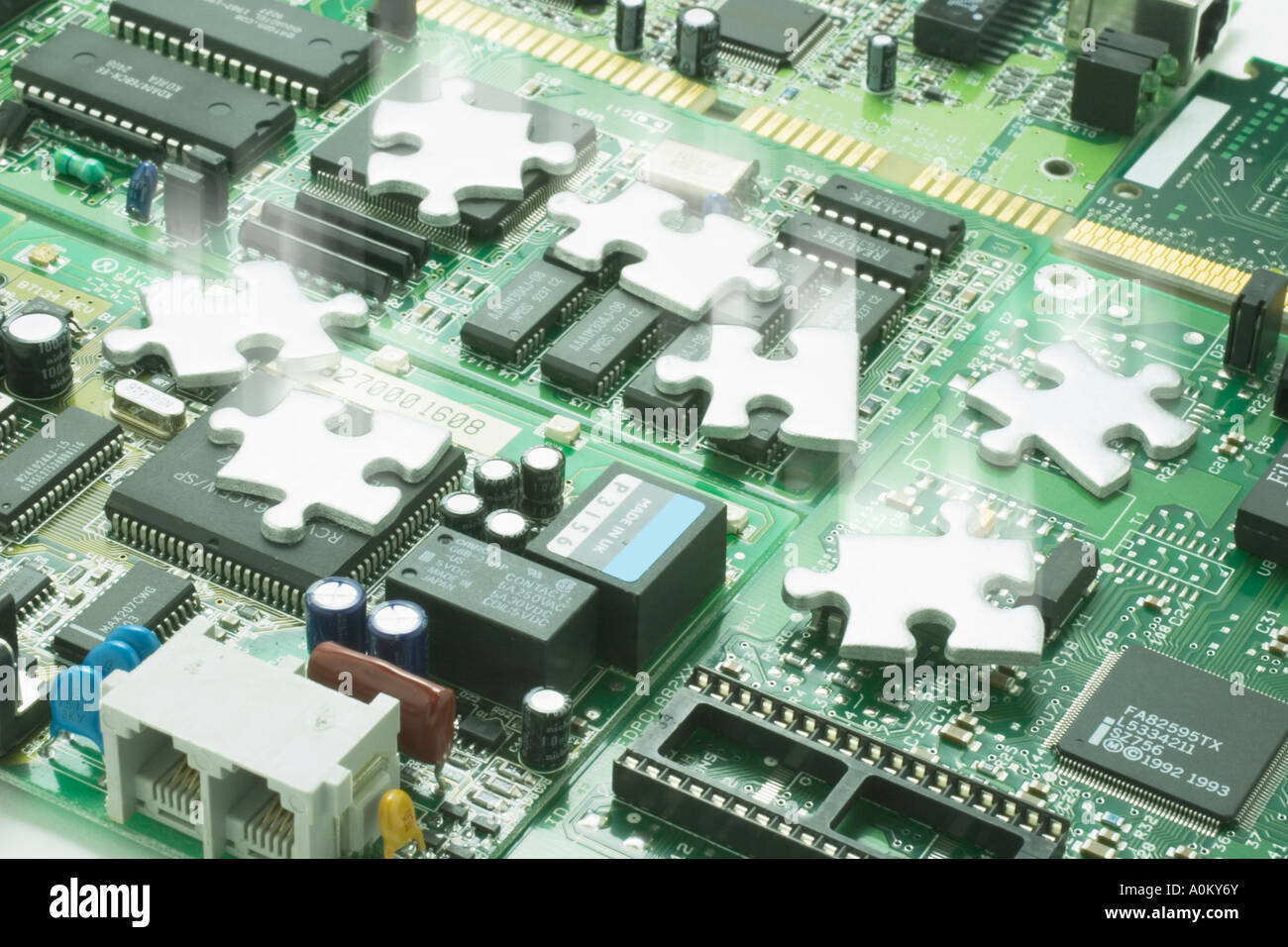Puzzle Pieces on Computer Circuit Board Stock Photo - Alamy