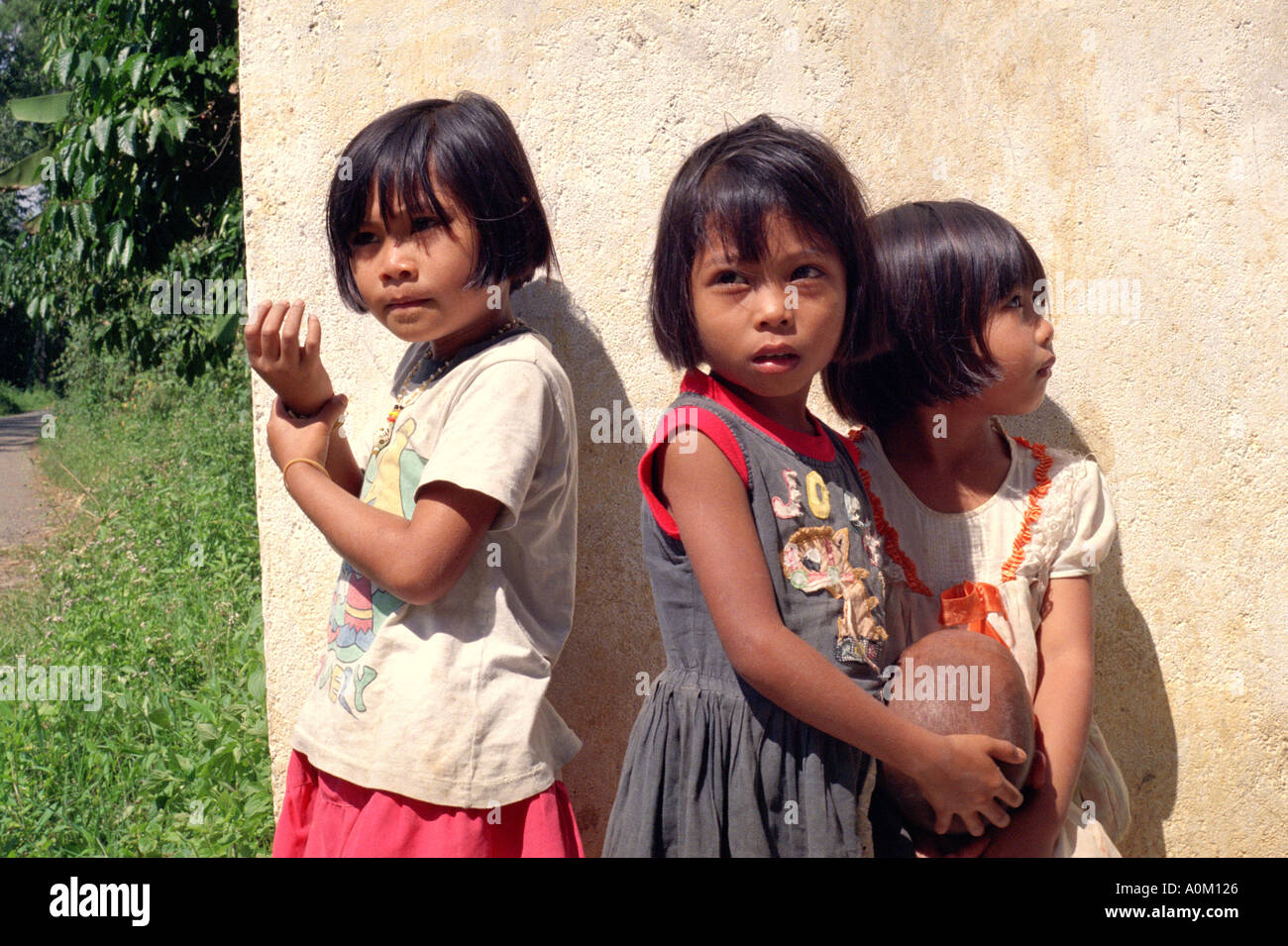Three girls with clay canteen in Tana Toraja Sulawesi Indonesia Indo ...