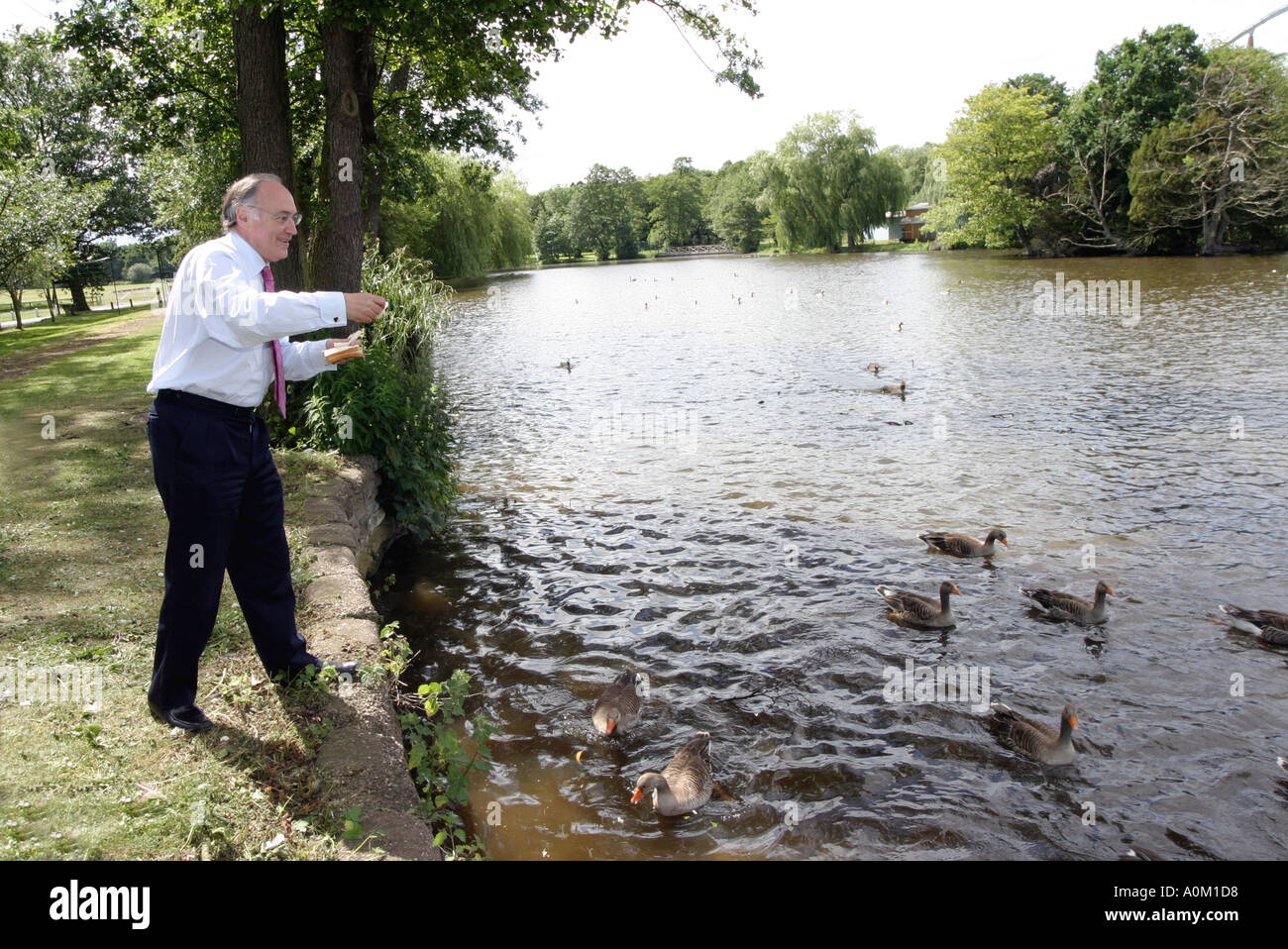 Ex leader of the Conservative Party Michael Howard feeding the ducks in ...