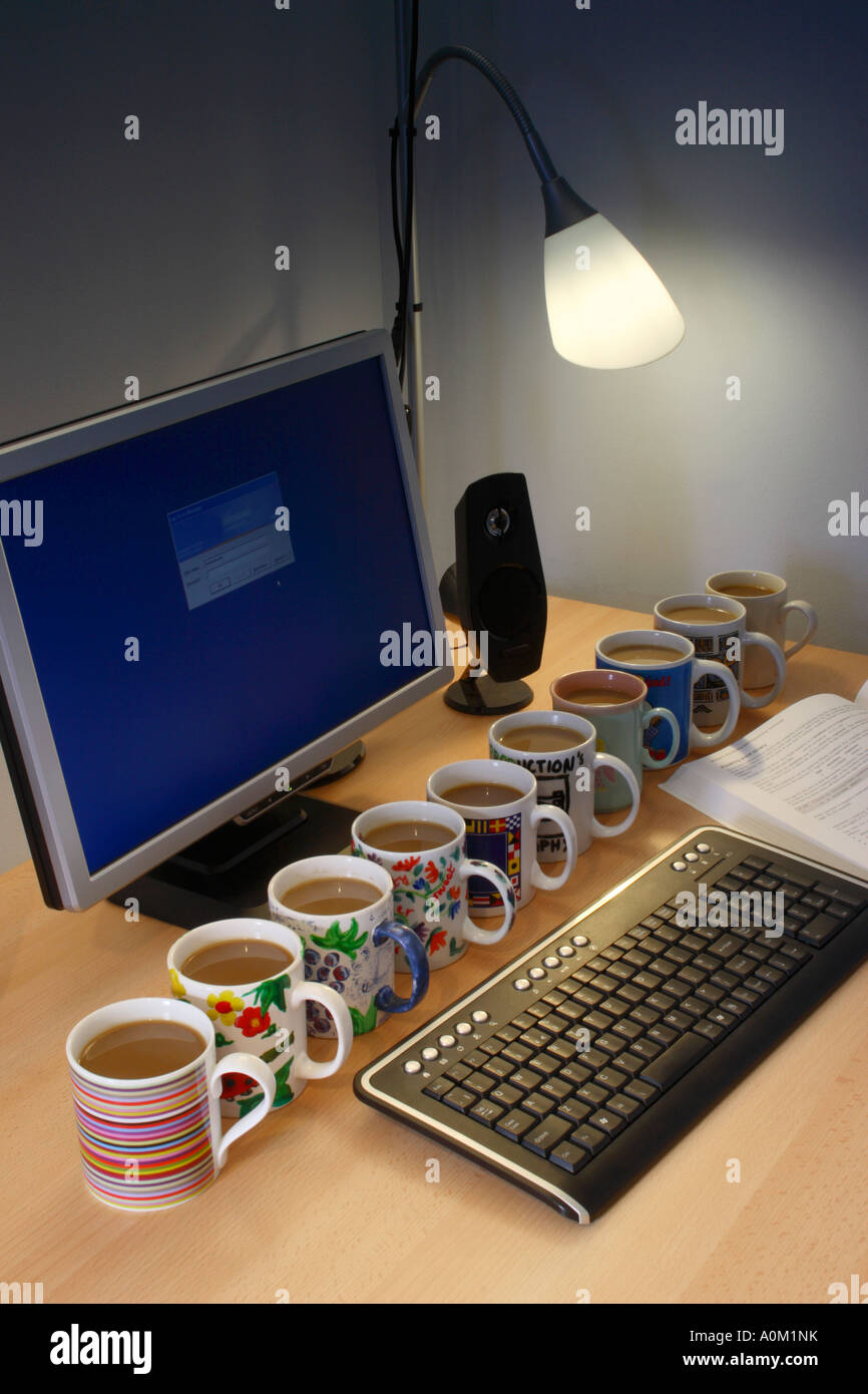 10 Mugs of Coffee lined up on a desk Stock Photo - Alamy