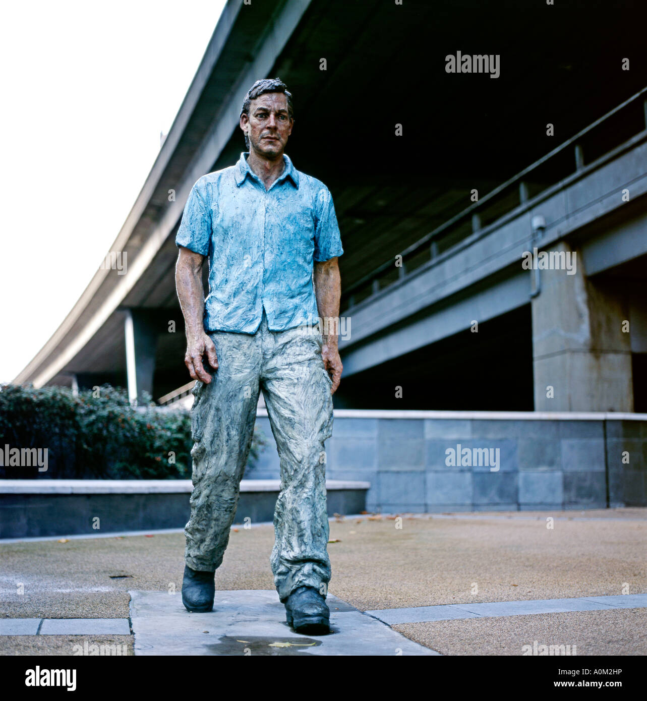 Sean Henry sculpture of Walking Man in Paddington Basin under the ...