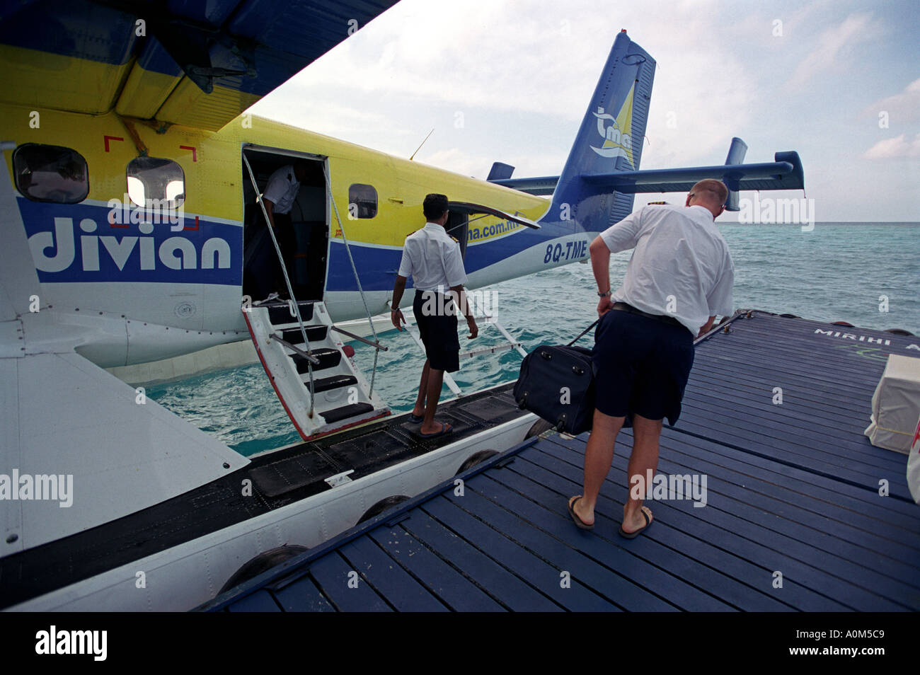 Seaplane transfer to boat at one of the island resorts in The Maldives ...