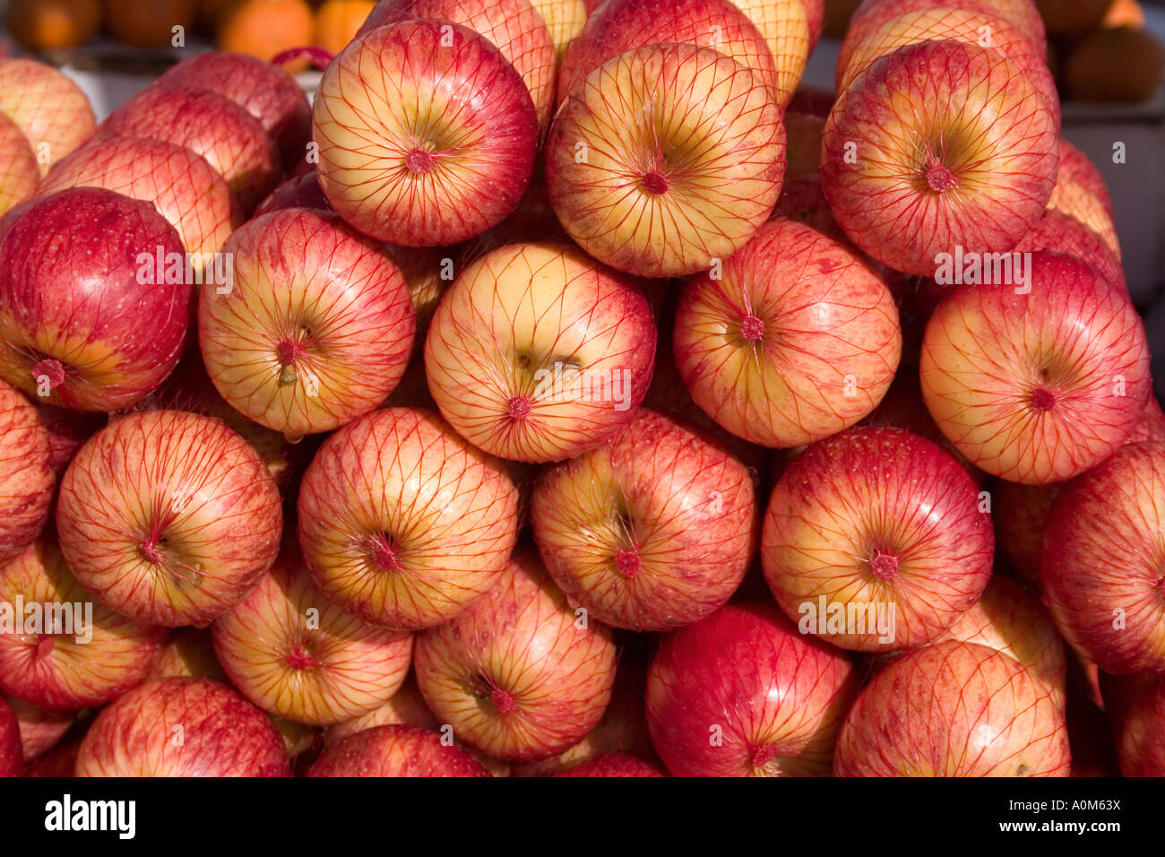 Red apples packed in sets of four 4 and piled fruit Stock Photo - Alamy