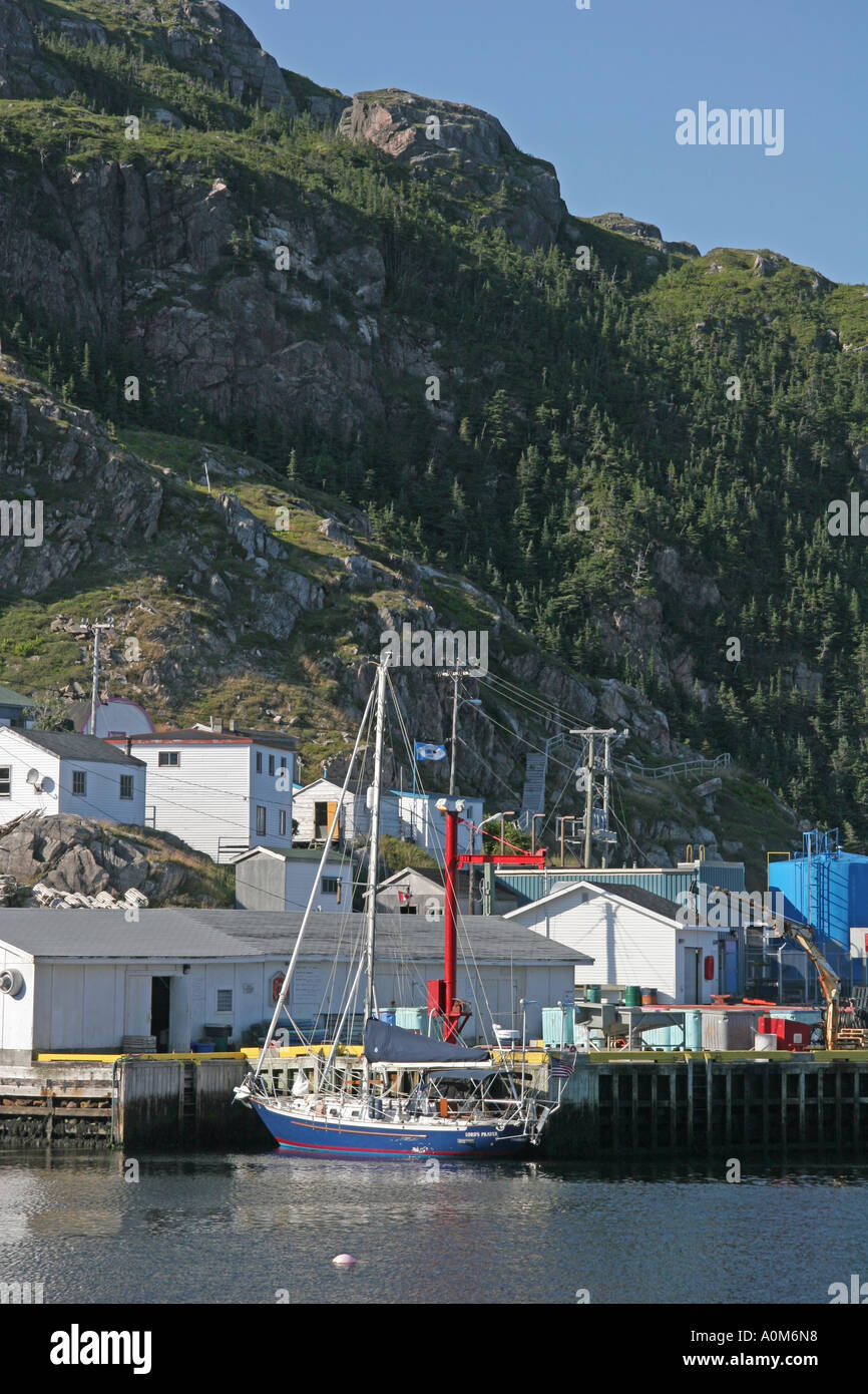 A sailboat lies alongside the Wharf at McCallum NL Stock Photo - Alamy