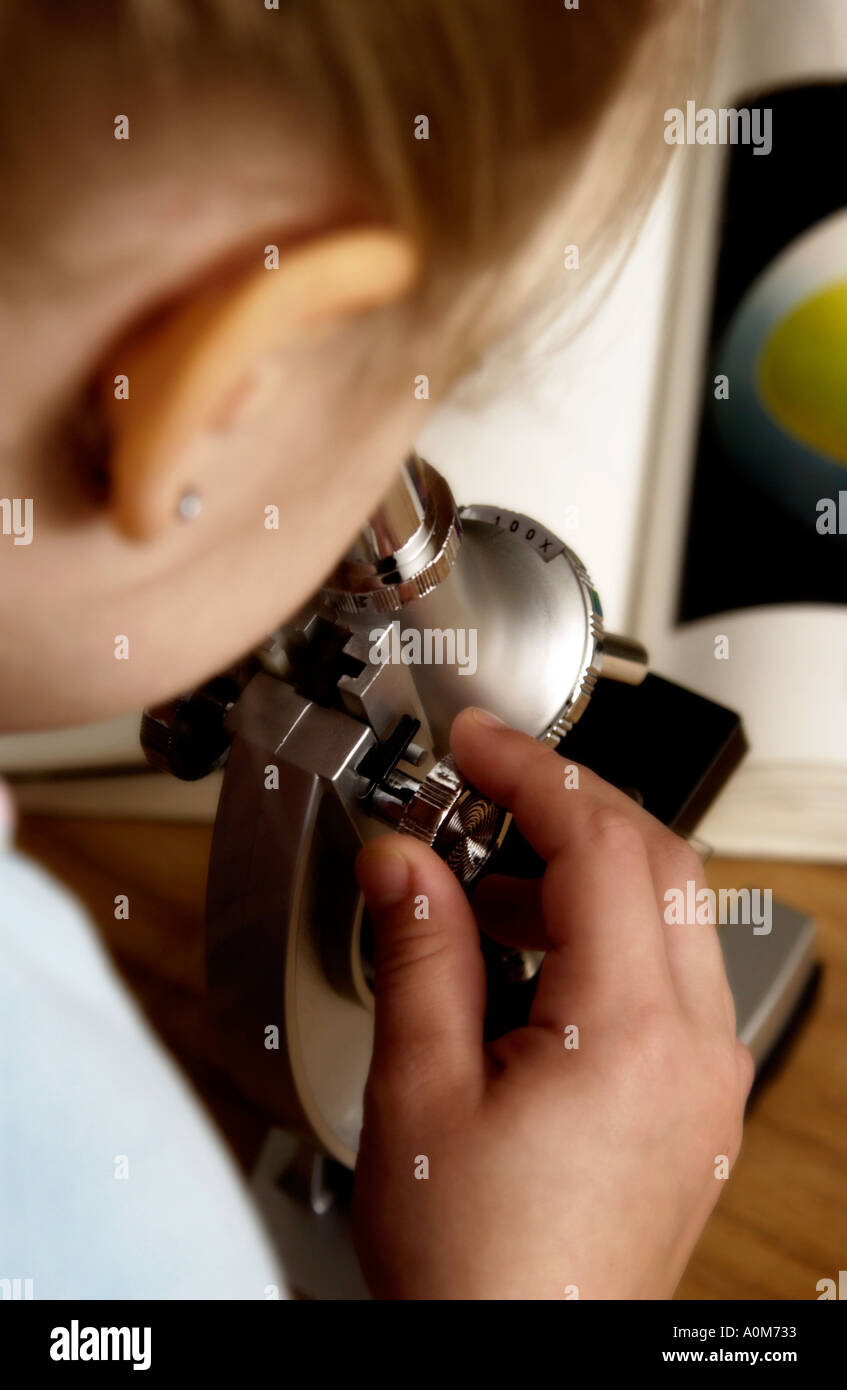 Student looking through microscope Stock Photo - Alamy
