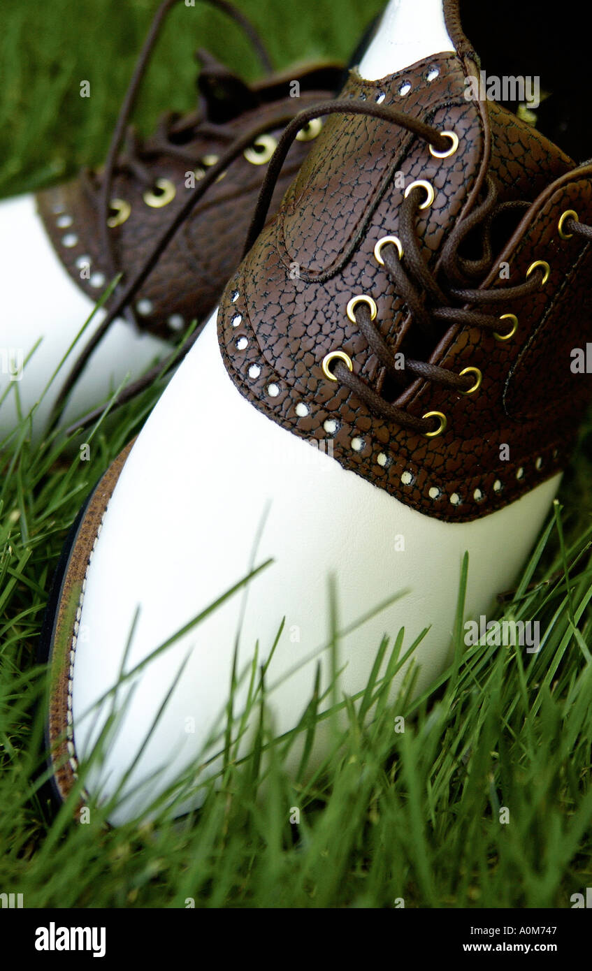 Pair of golf shoes in the green grass Stock Photo - Alamy
