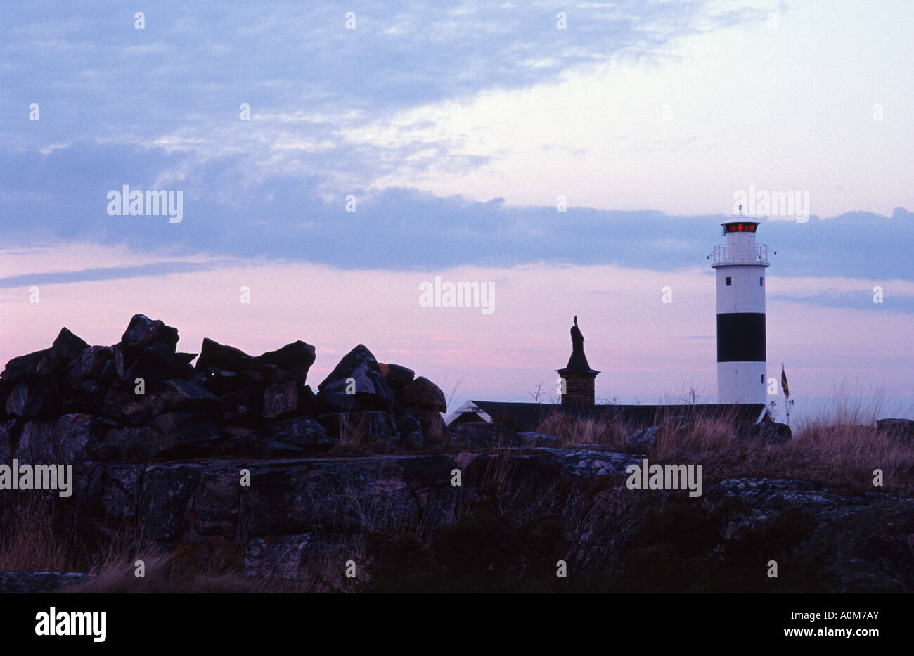 Lighthouse at dusk Stock Photo - Alamy