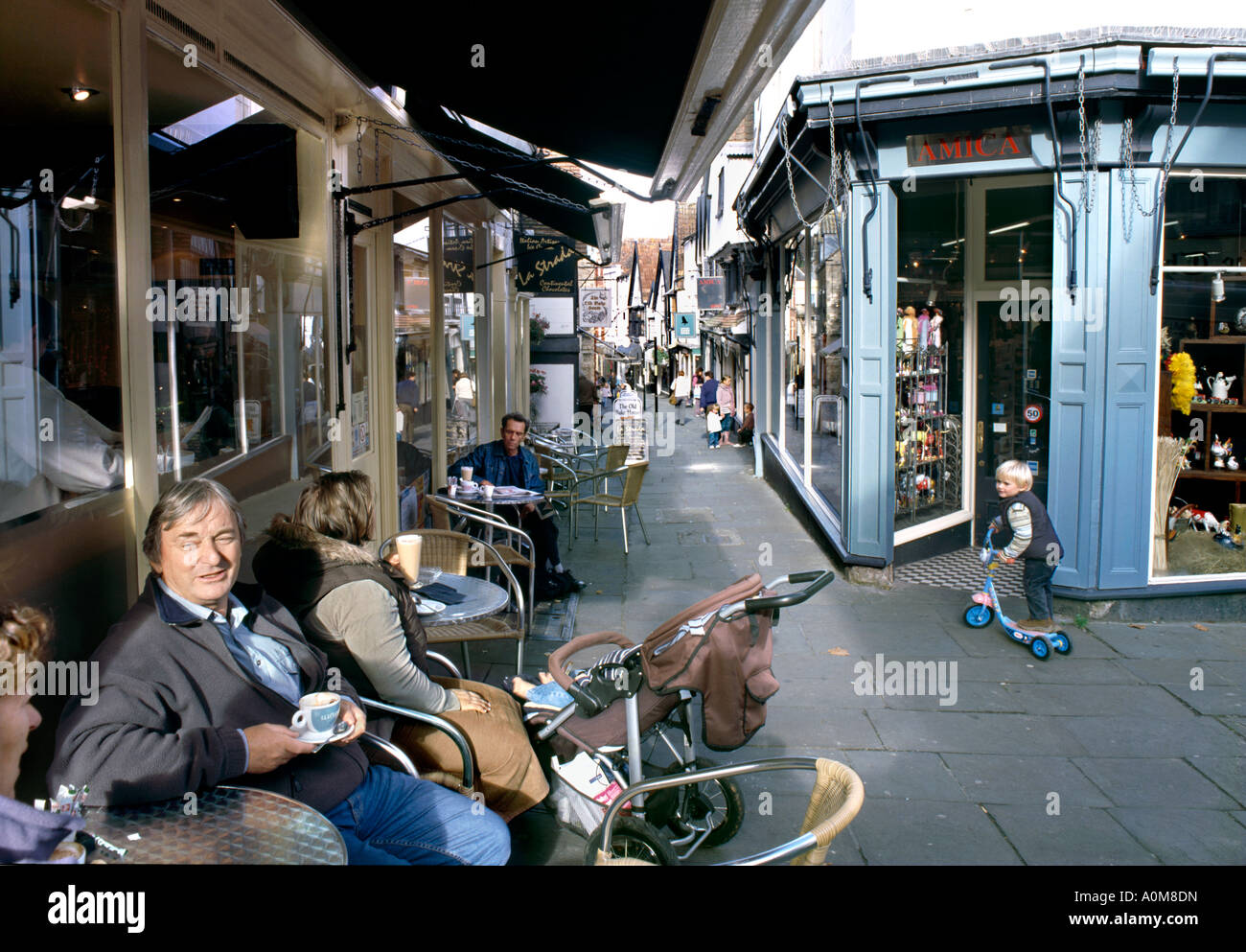 Drinking a coffee outside a cafe on Cheap St, Frome, Somerset, England ...
