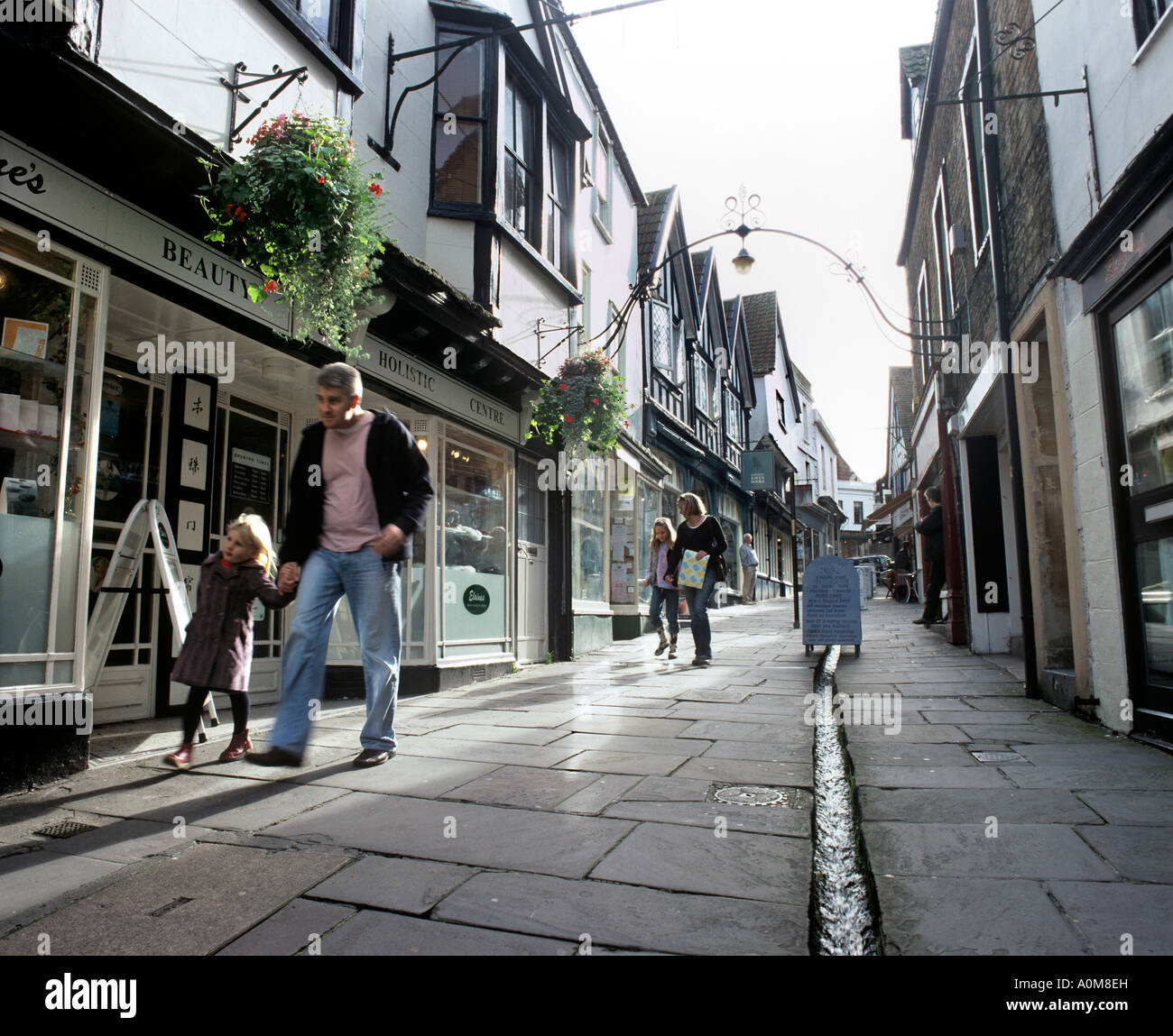 Water runs down a culvert in Cheap Street, Frome, Somerset, England ...