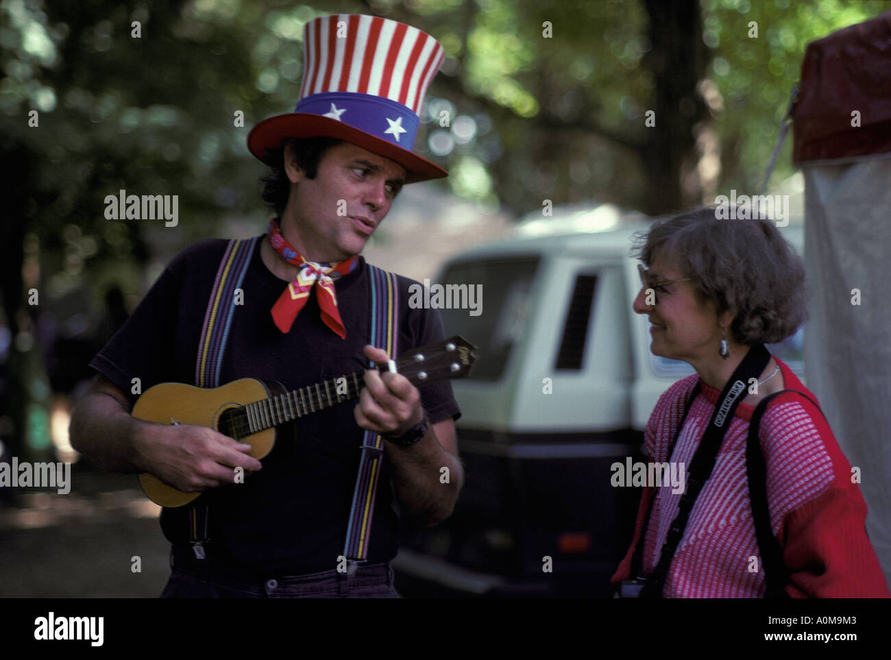 Uncle Sam serenades tourist Russian visitor with ukulele red white blue ...