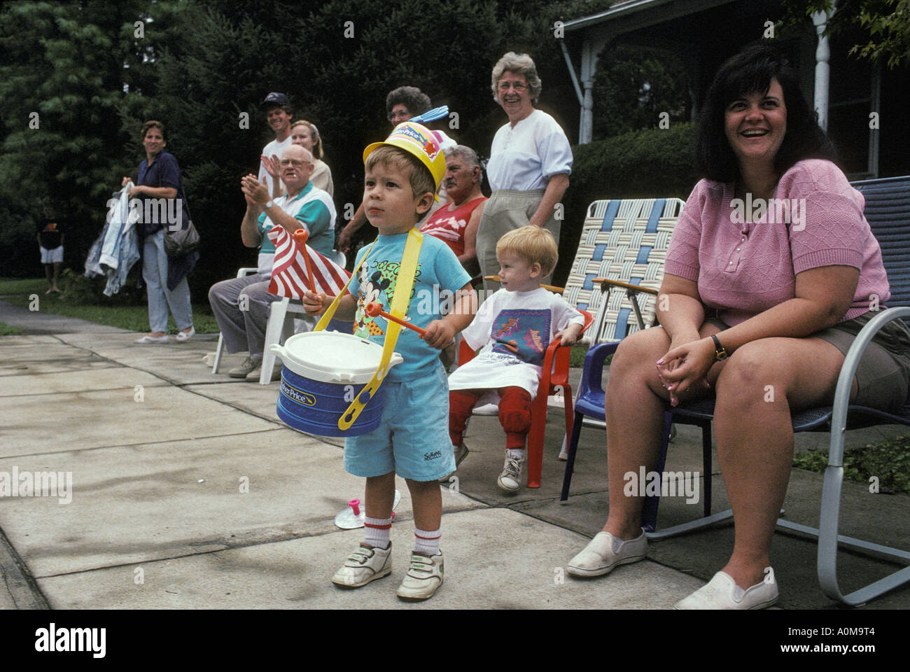 family families watch small town paarade little drummer boy Stock Photo ...